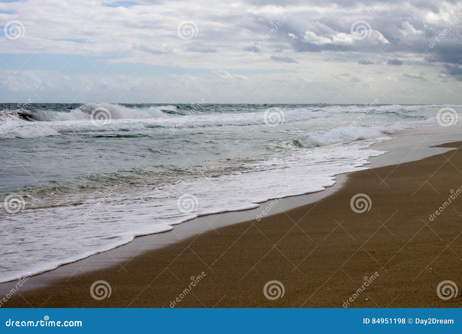 Windy day at the beach stock photo. Image of morning - 84951198