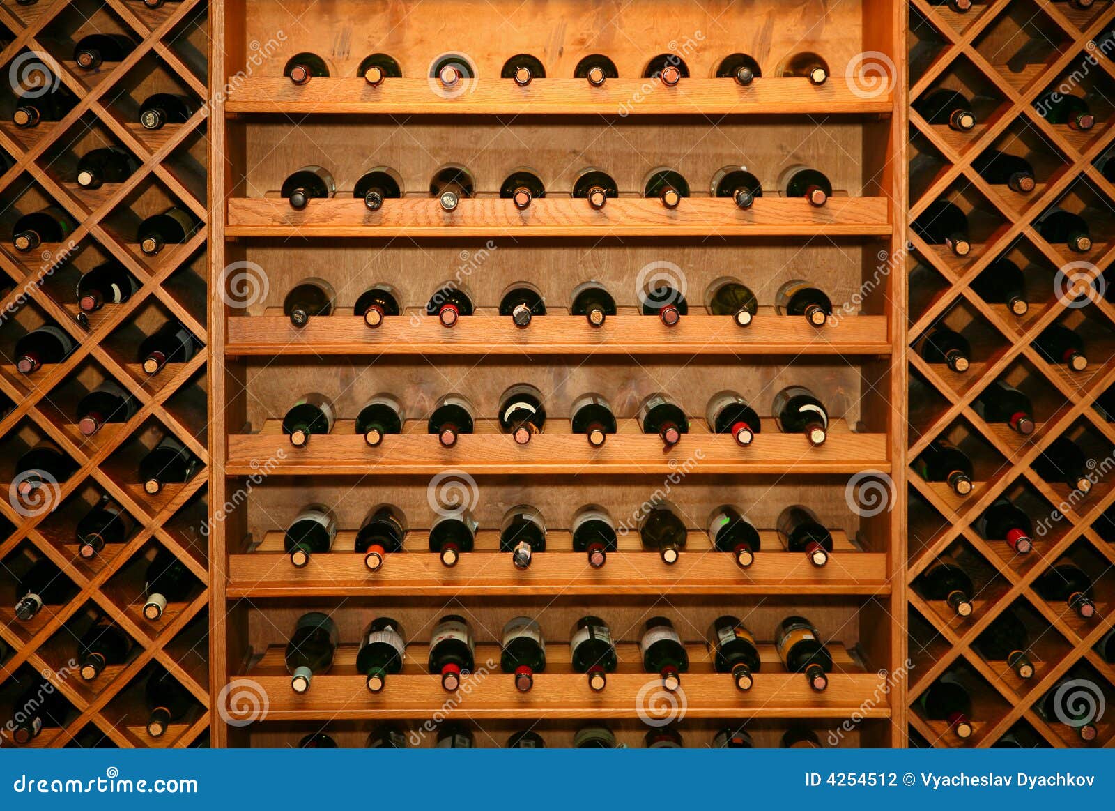 Wine. Luxury Home Wine Cellar. Bottles of Wine Stacked End on in a ...
