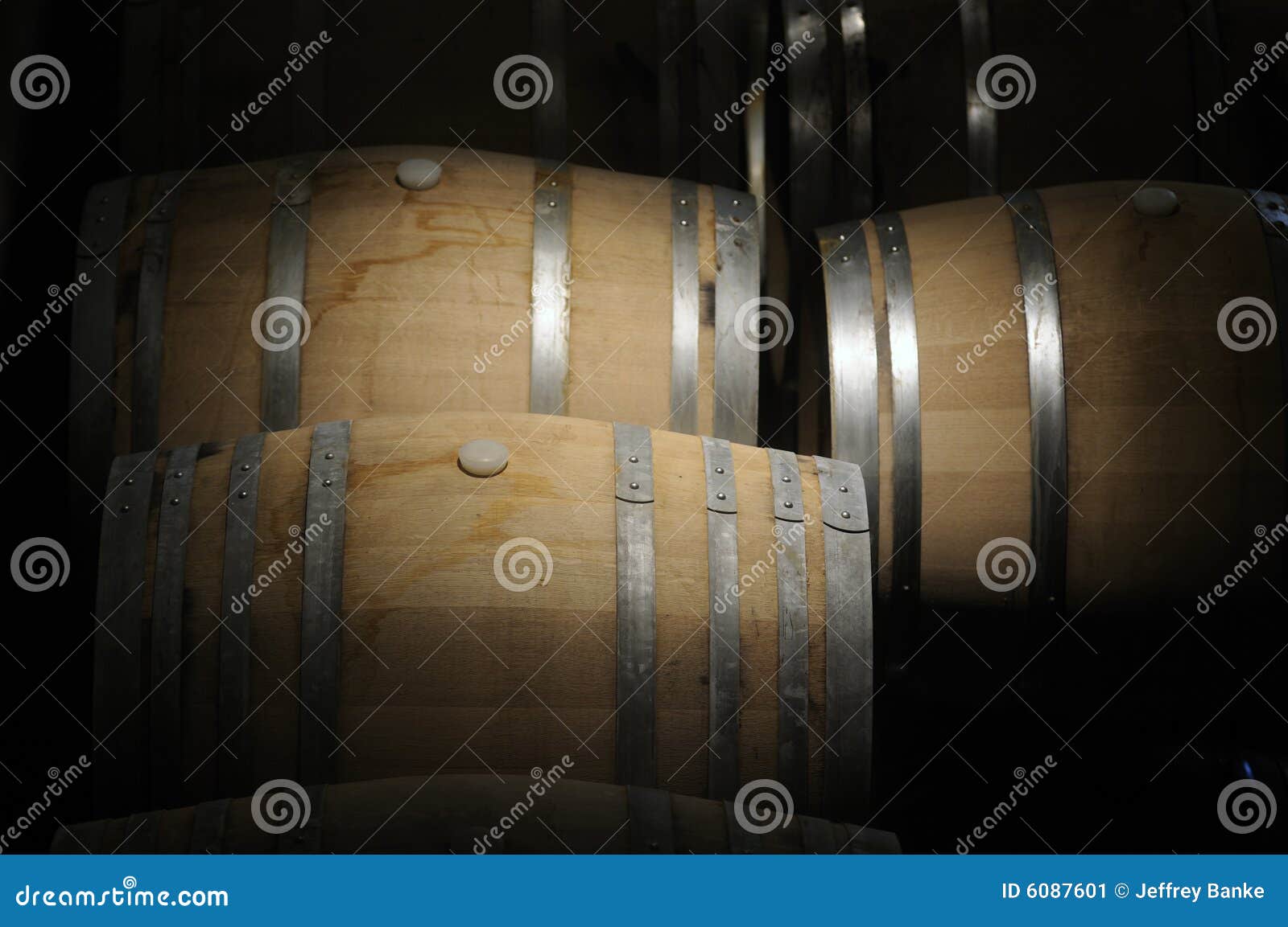 Wine Barrels in a Dark Cavern Stock Image - Image of illuminated, rivet ...