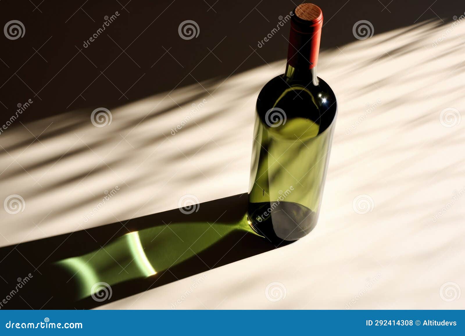 Wine Bottle at a Diagonal Angle Casting Long Shadows Stock Photo ...