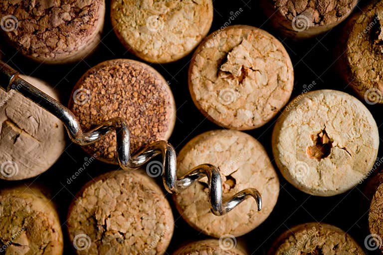 Wine Corks of Different Sizes and a Corkscrew Standing Upright on an ...