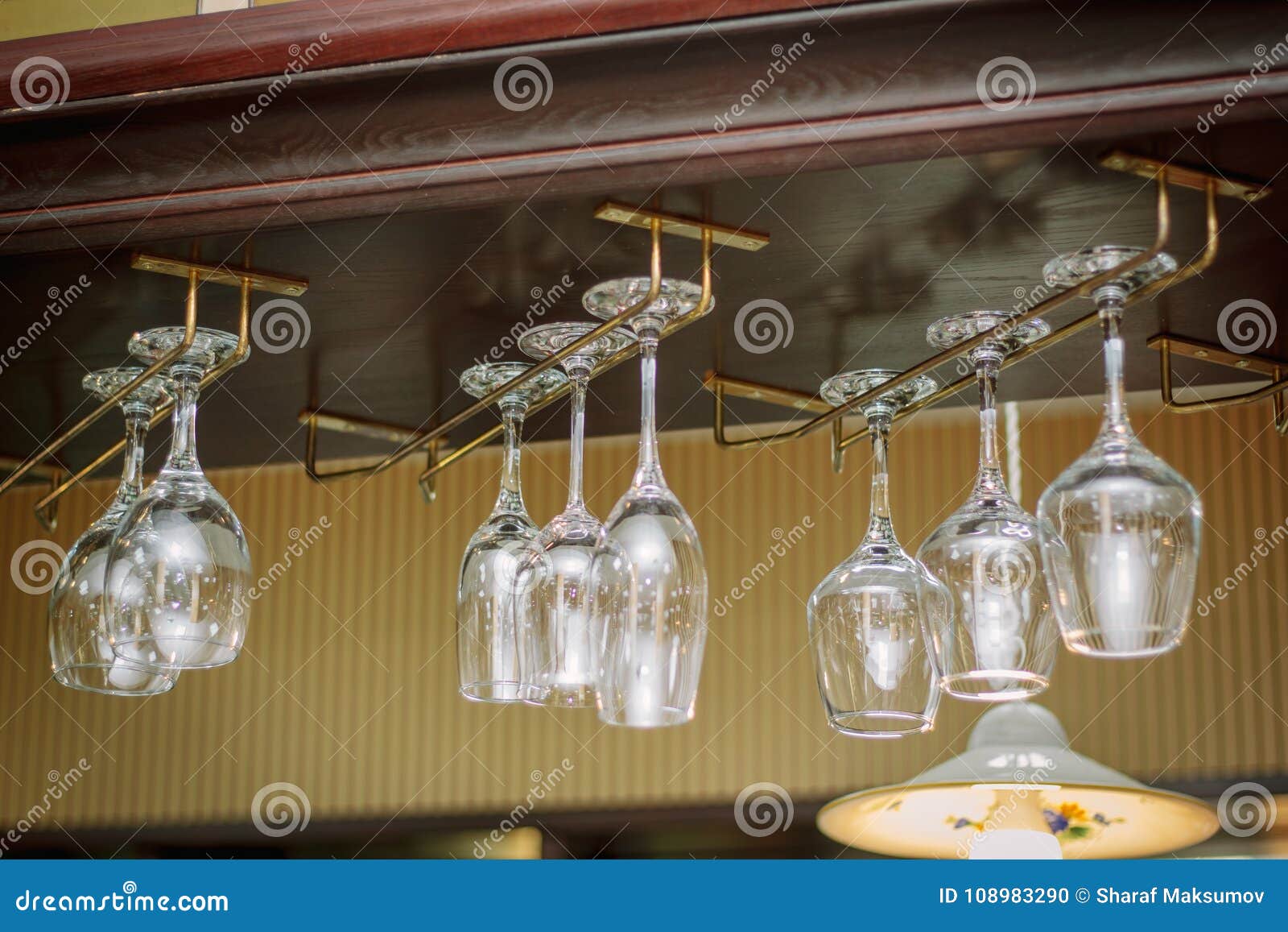 Wine Glasses in a Bar on Wooden Rack. Stock Photo - Image of ...