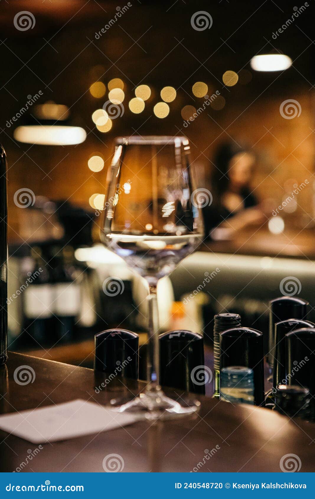Wine Glasses and Bottles of Wine in the Entourage of the Wine Bar in ...