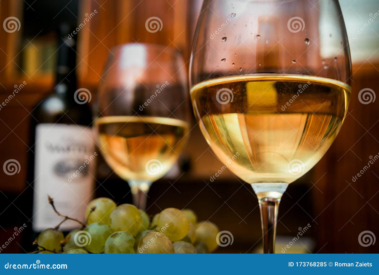 Wine in the Glasses with Grapes. on the Table. Background. Stock Image ...
