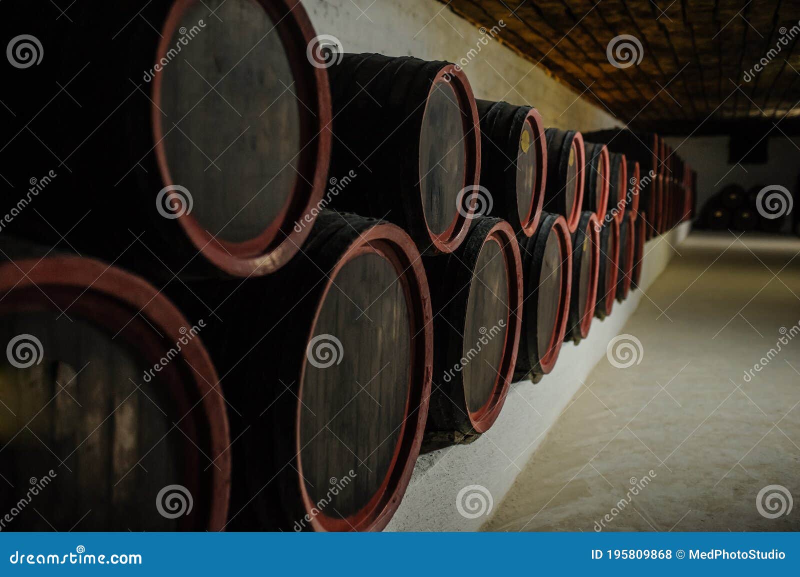 Wooden Barrels Inside The Underground Tunnels Of A Winery Stock Photo ...