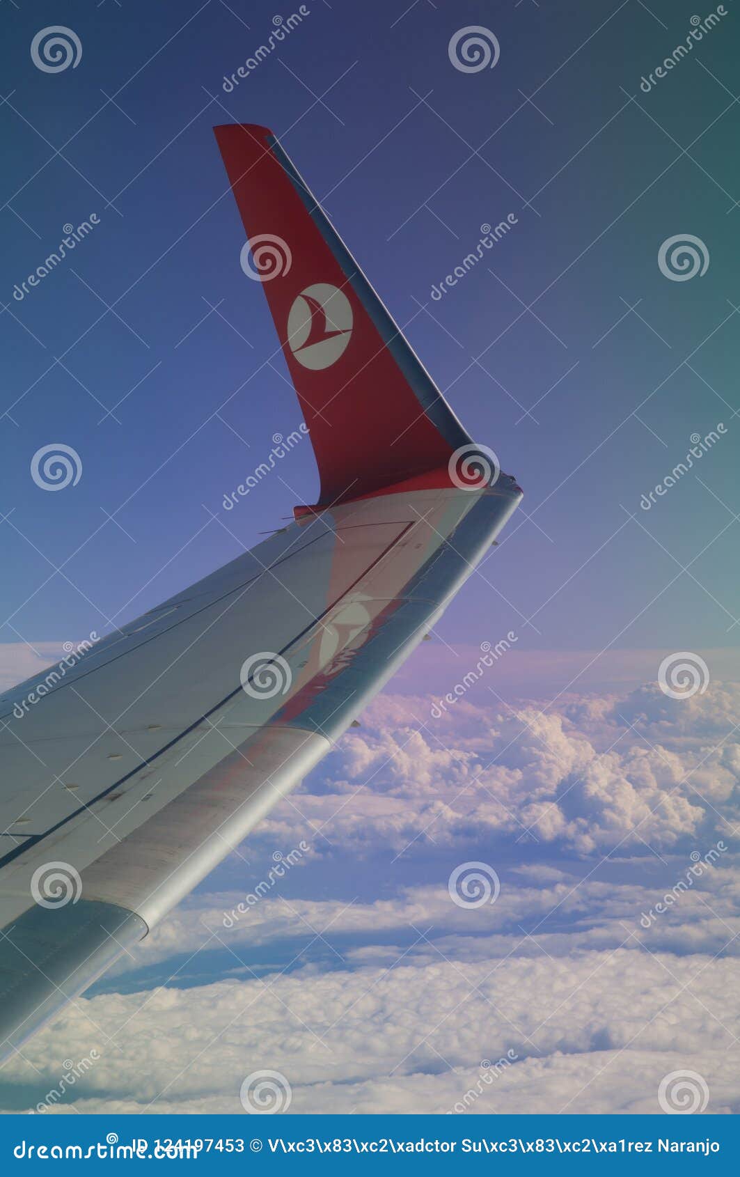 Wing airplane in flight. editorial stock photo. Image of cloud - 124197453