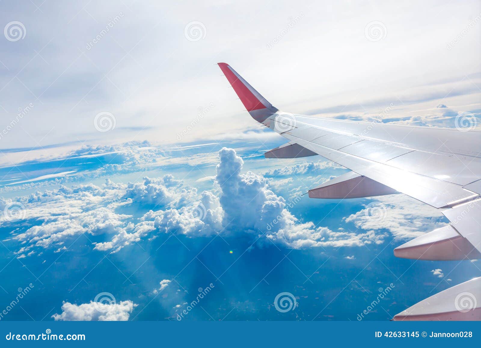 Wing of an Airplane Flying Above the Clouds View Stock Image - Image of ...