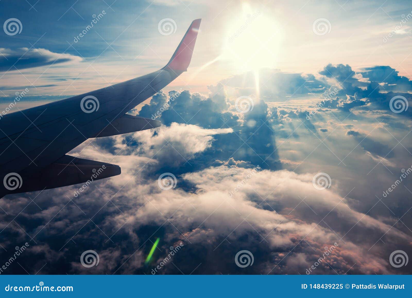 The Wing of Airplane and Sunset on Blue Sky and Beautiful Clouds.Light ...