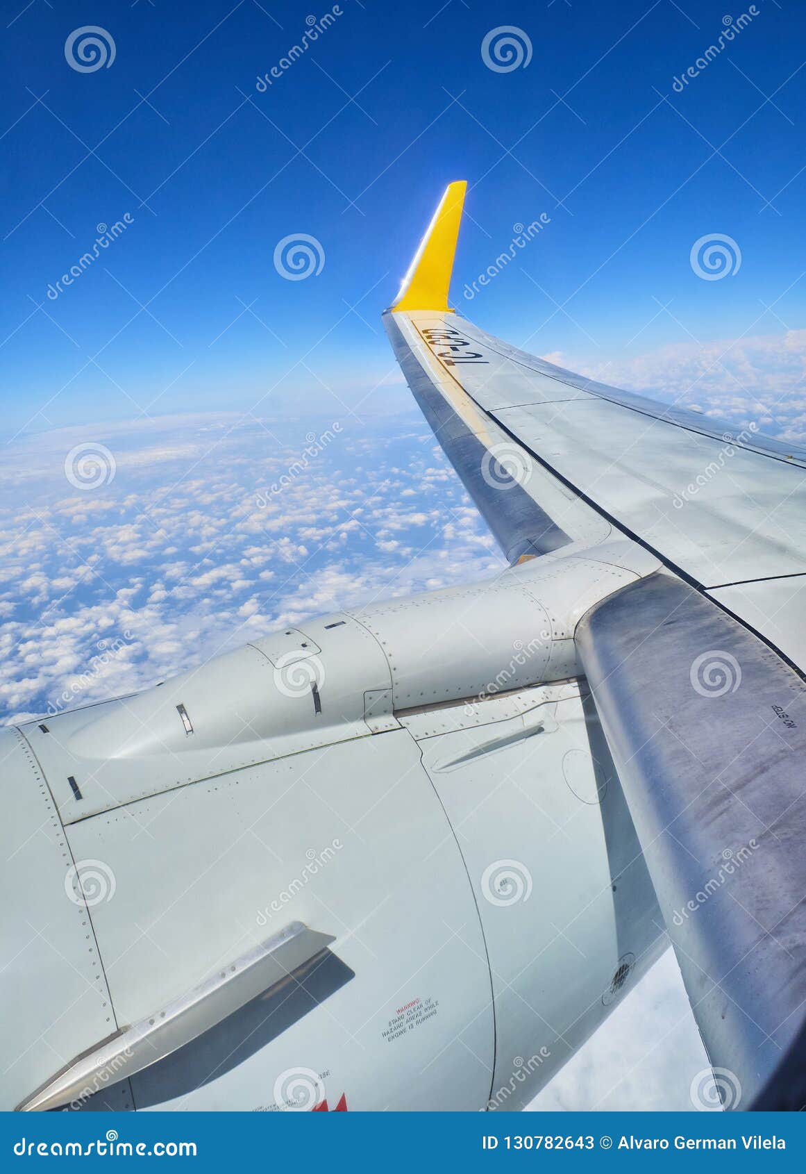 Wing and Engine of a Commercial Airplane in Flight. Editorial Stock ...