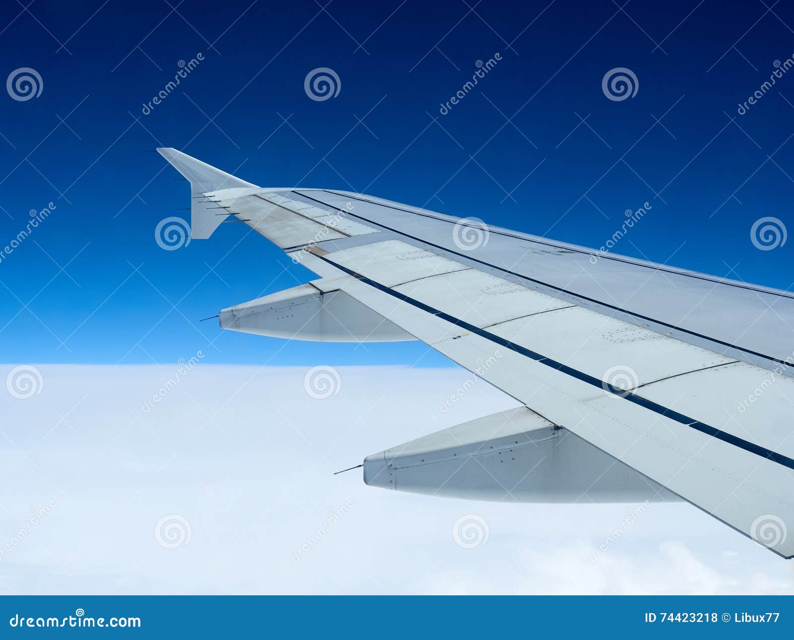 Wing flying airplane stock photo. Image of carpet, flight - 74423218