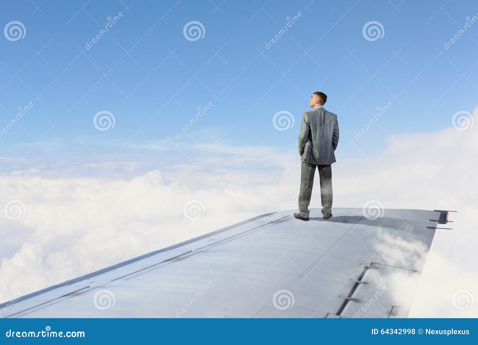 On wing of flying airplane stock photo. Image of launch - 64342998