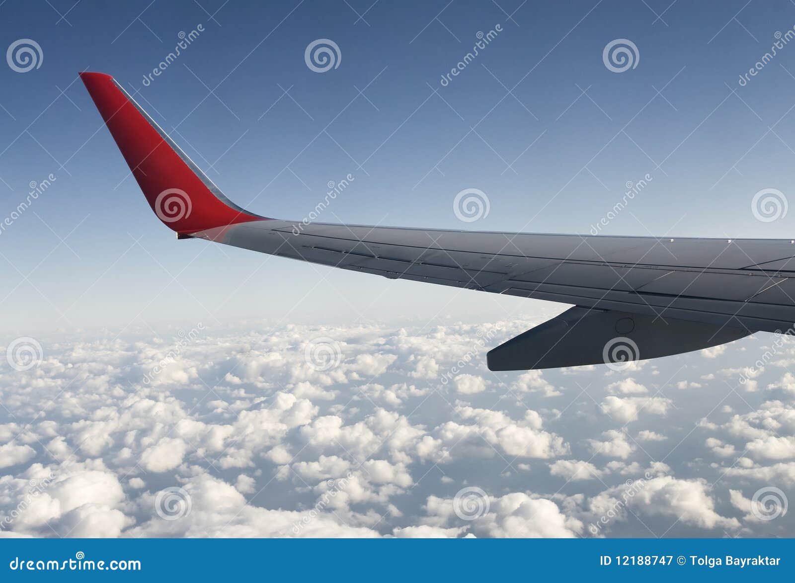 Wing over clouds stock image. Image of public, flying - 12188747