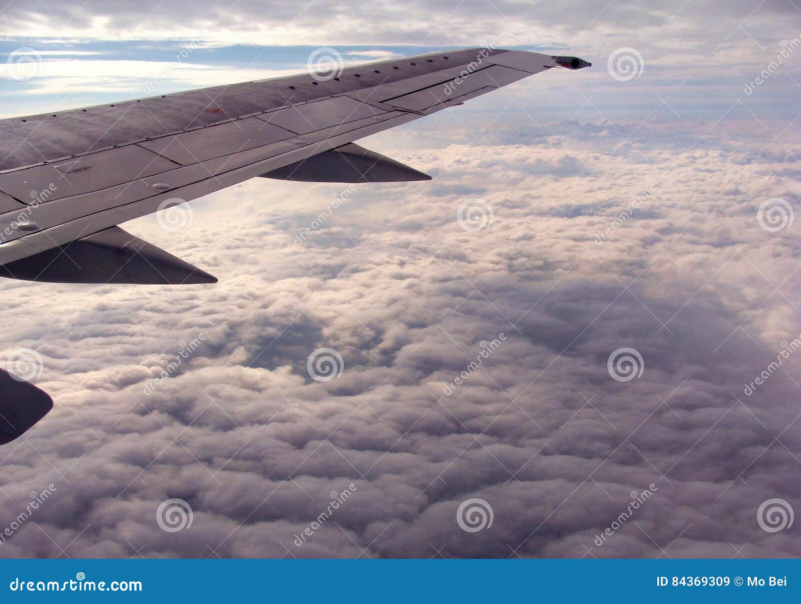 Wing over clouds stock image. Image of holidays, jeorney - 84369309
