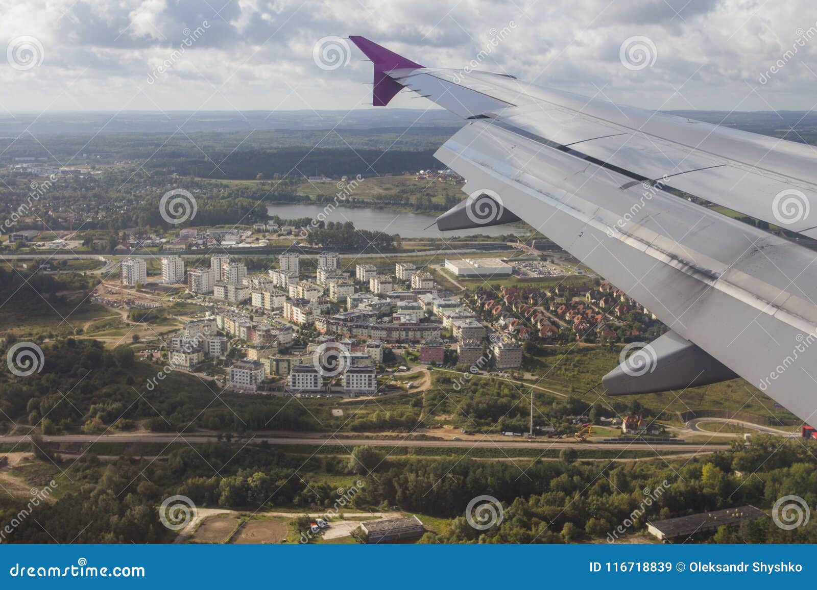 The Wing of the Plane in Flight Over the City Stock Image - Image of ...