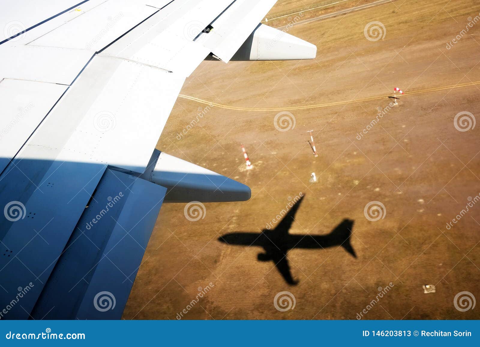 Wing and Shadow of a Plane during the Flight. Stock Image - Image of ...