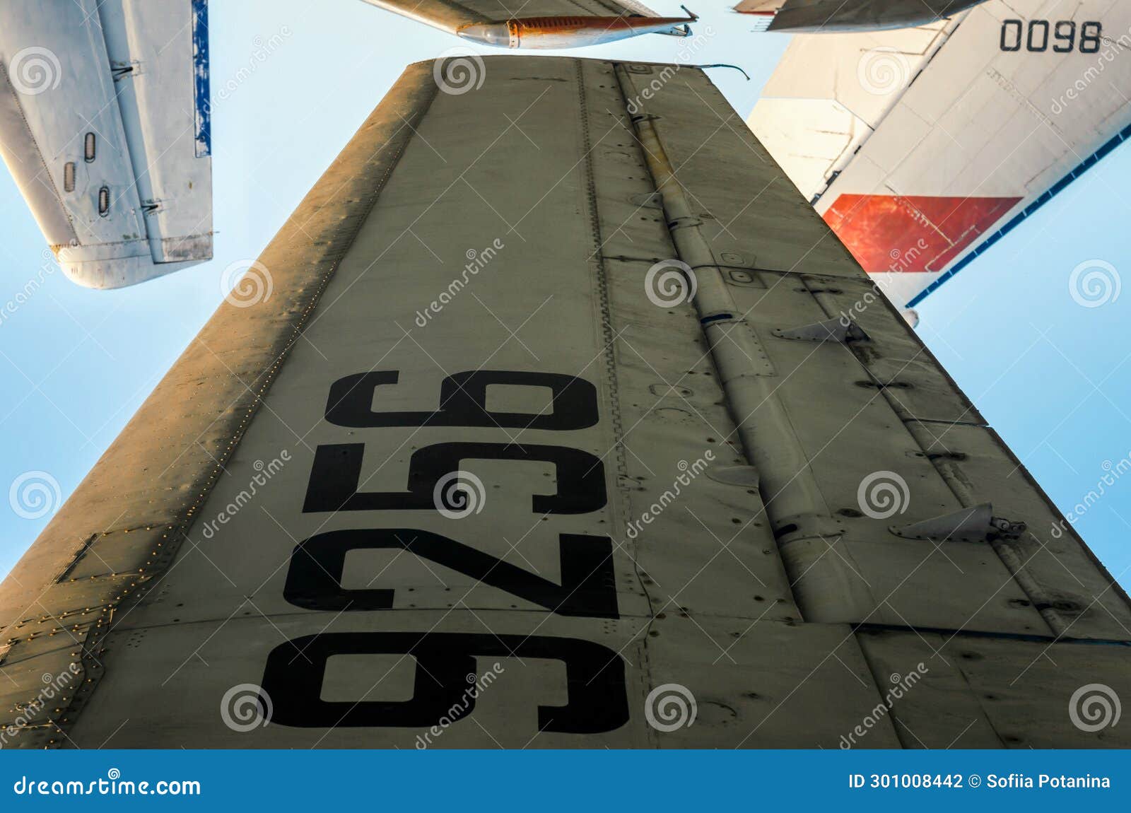 Wing with Tail Number on the Background of Airplanes and Blue Sky Stock ...