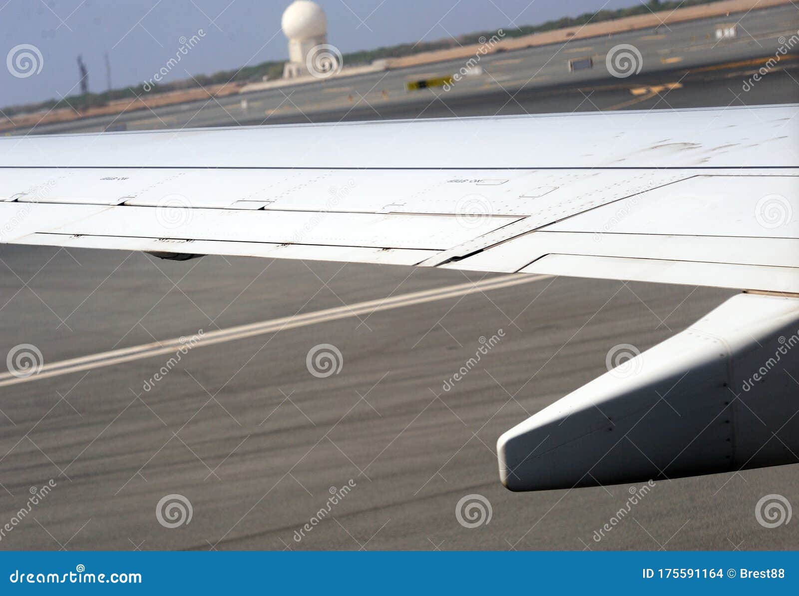 The Wing of a Take-off Airplane on the Background of the Airport Stock ...
