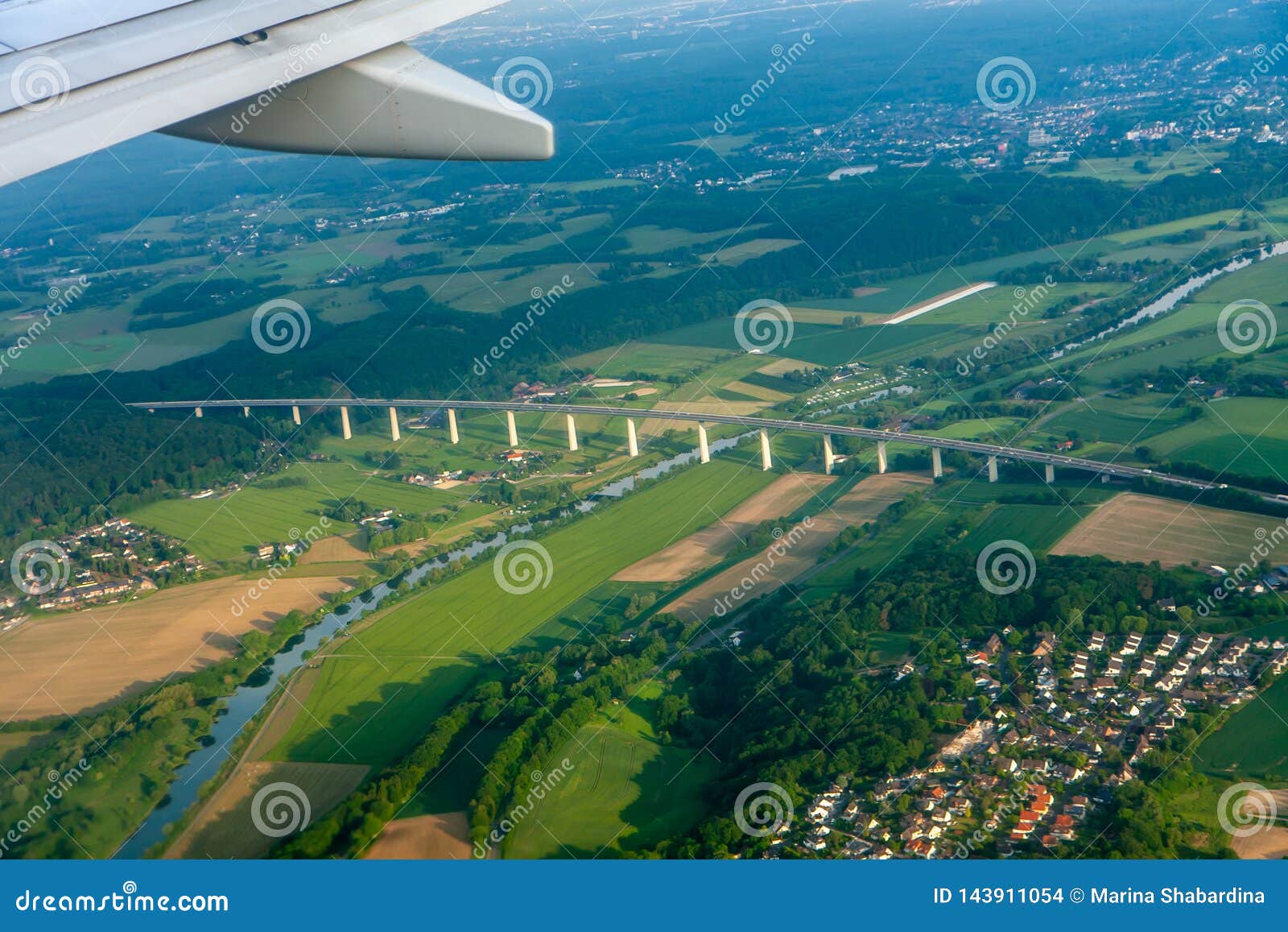 Wing, Village and Bridge Over the River Top View from the Plane Stock ...
