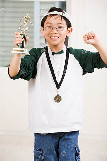 Winning Boy with His Medal and Trophy Stock Photo - Image of ...