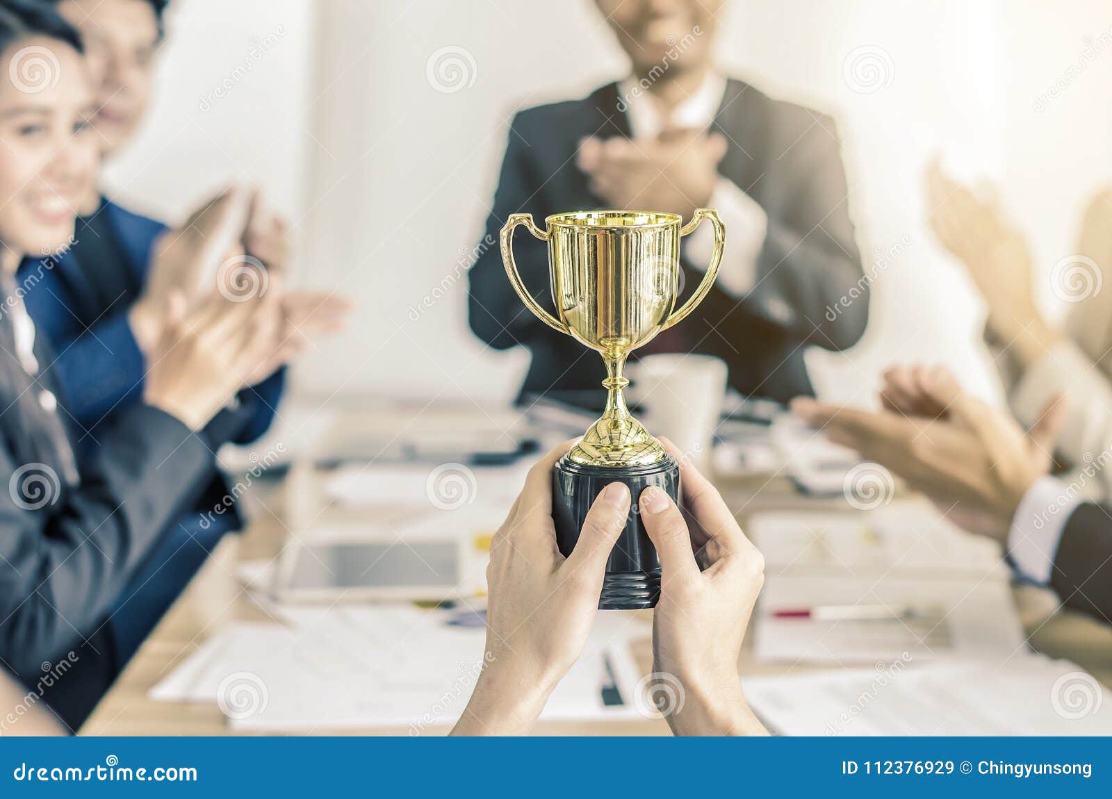 Winning Businessteam Leader Holding Trophy Stock Photo | CartoonDealer ... Winning Businessteam Leader Holding Trophy Stock Photo | CartoonDealer ...