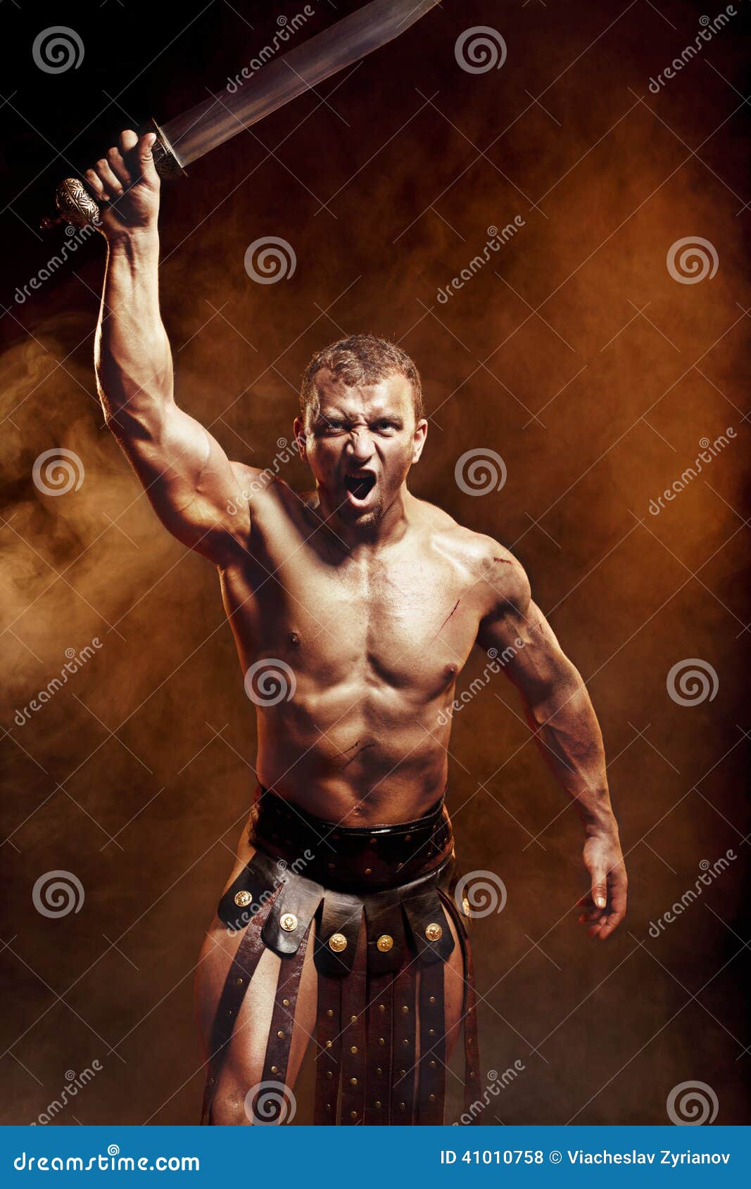 Winning Gesture of Gladiator Standing in a Smoke in Helmet and with ...