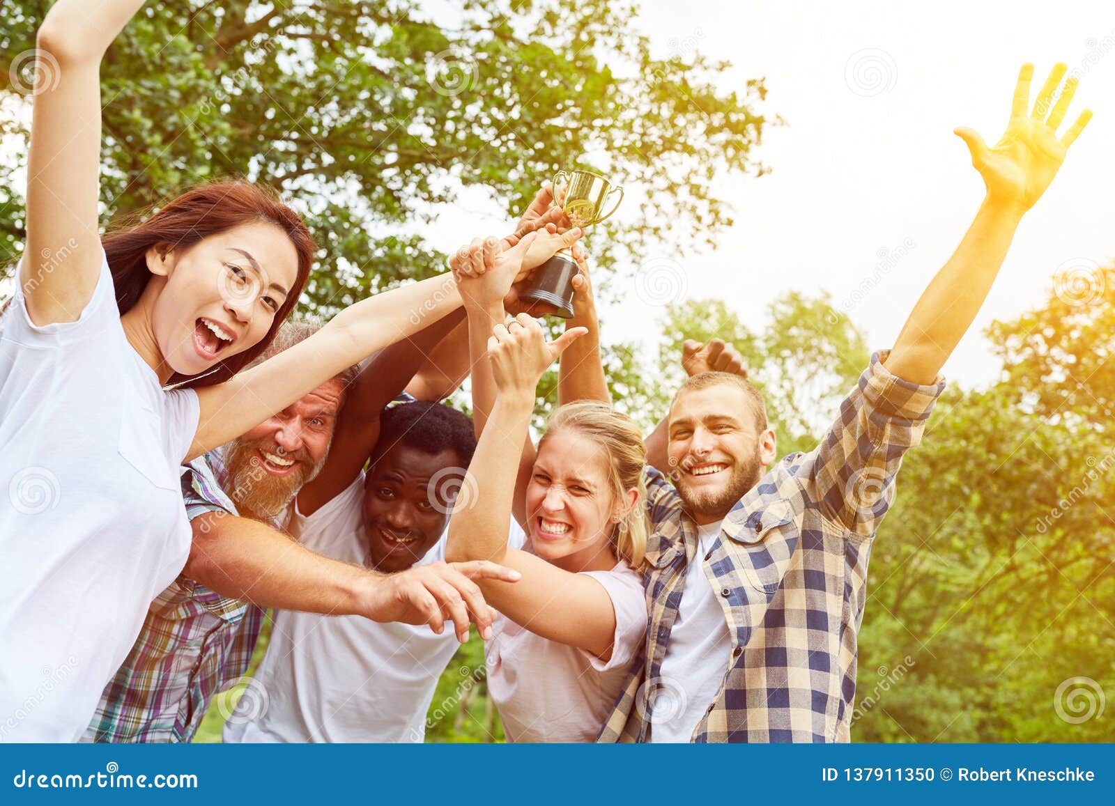 Winning Team Cheering with Cup Stock Photo - Image of park ...