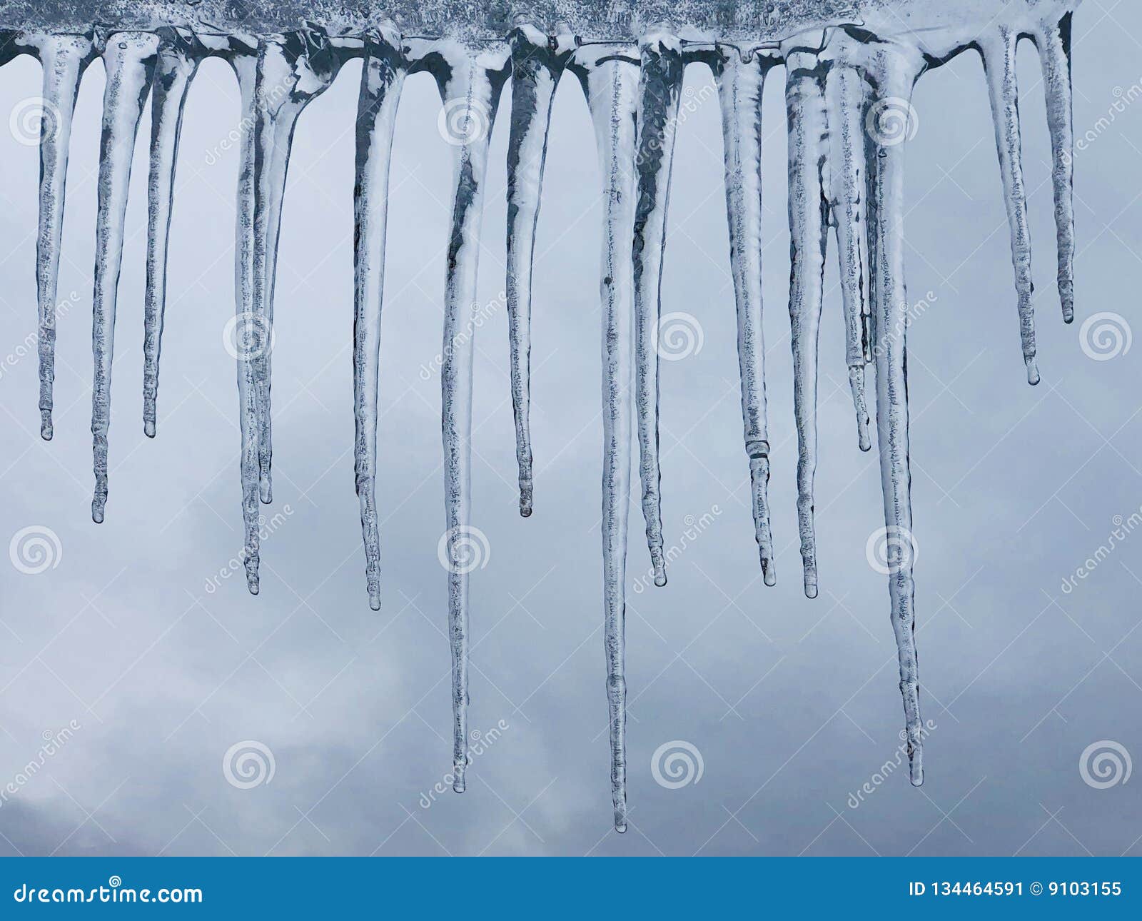 Winter Background with Icicles and Cloudy Sky Stock Image - Image of ...