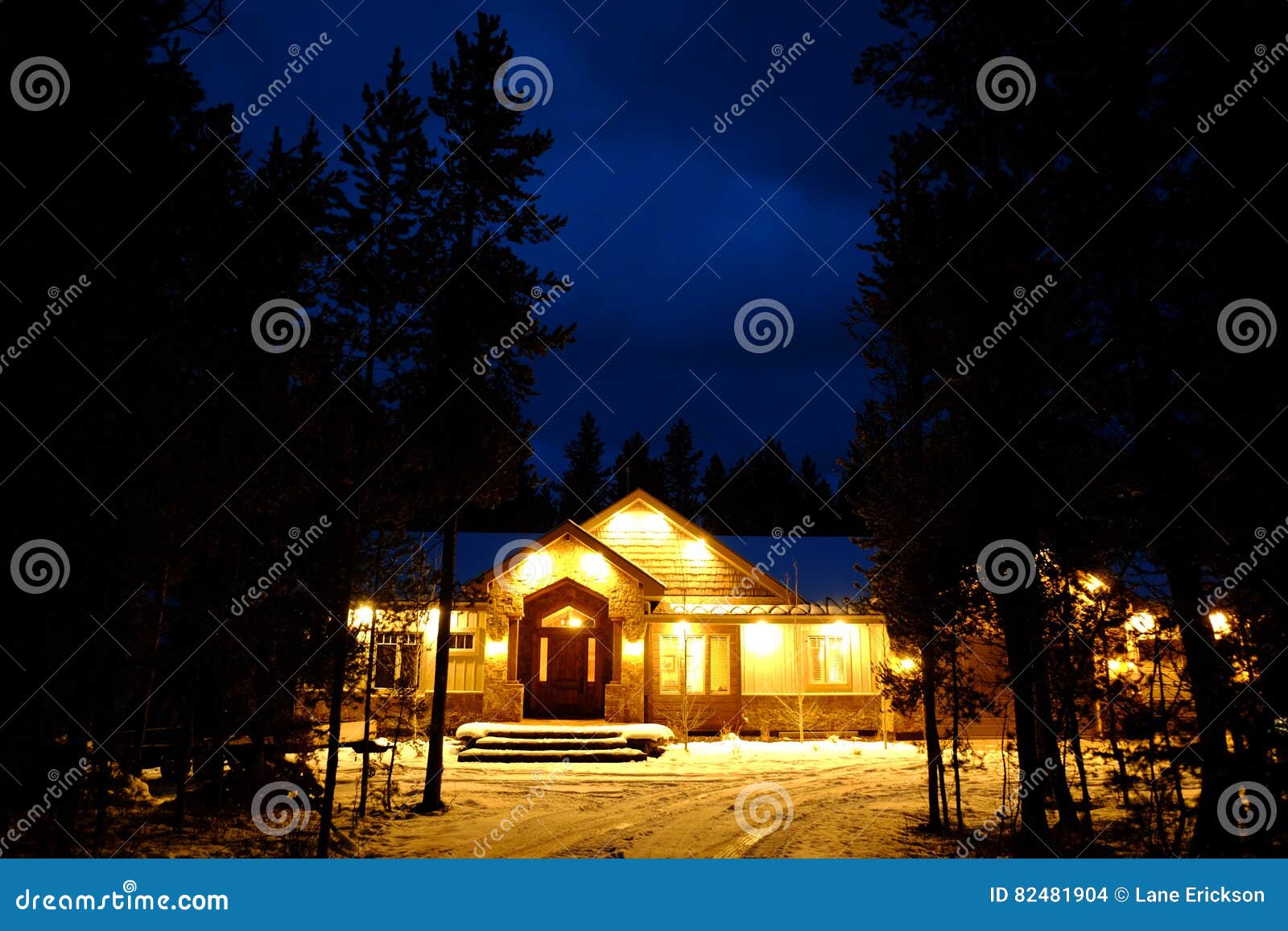 Winter Cabin at Night with Snow and Warm Glowing Lights Stock Photo ...
