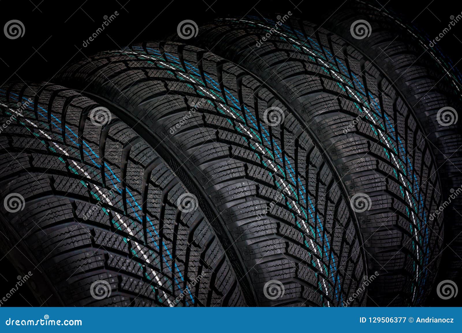 Winter Car Tires in Row Isolated on Black Stock Image - Image of ...