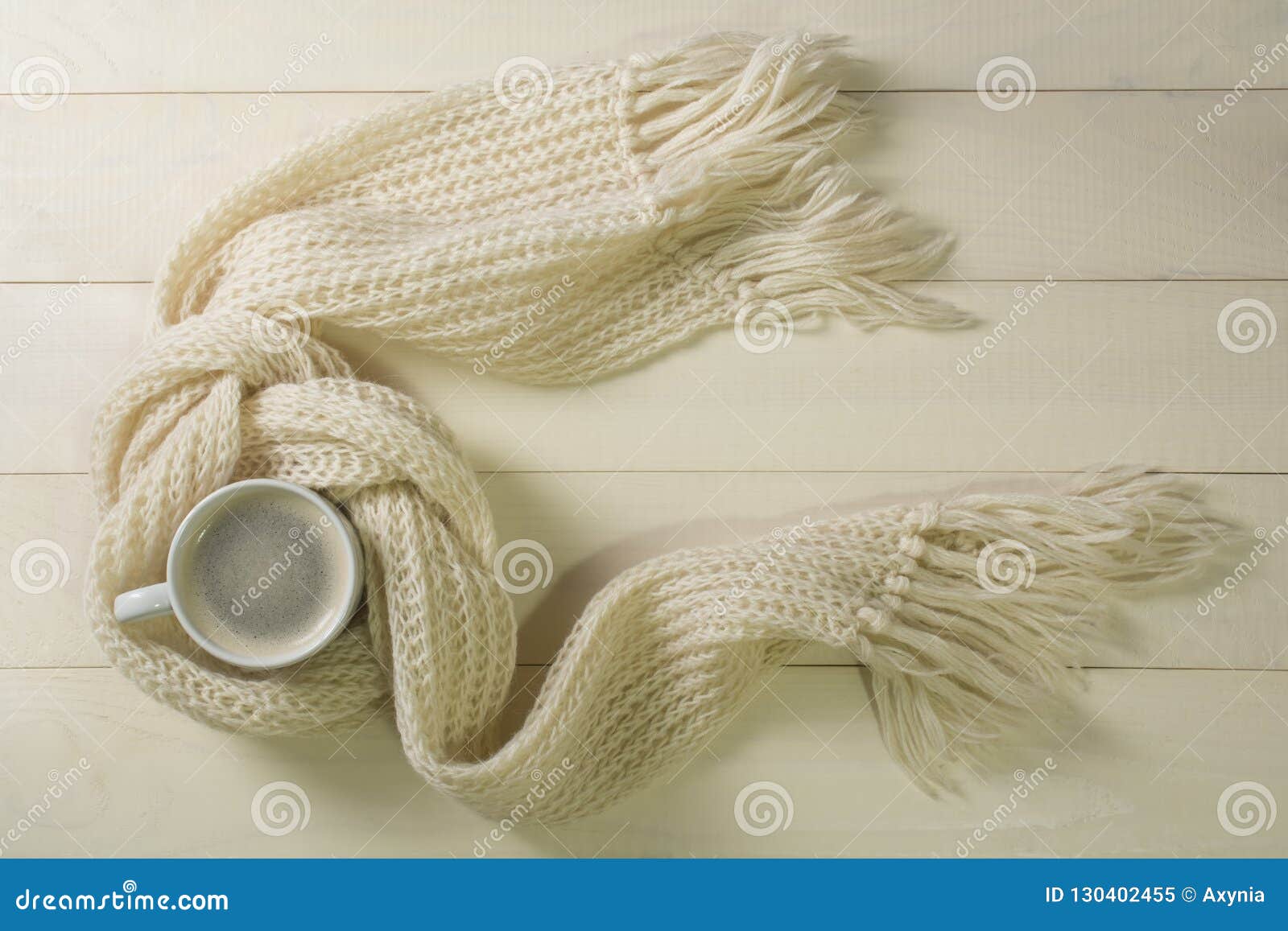 Winter Concept. Hot Coffee and White Woolen Scarf on White Table ...