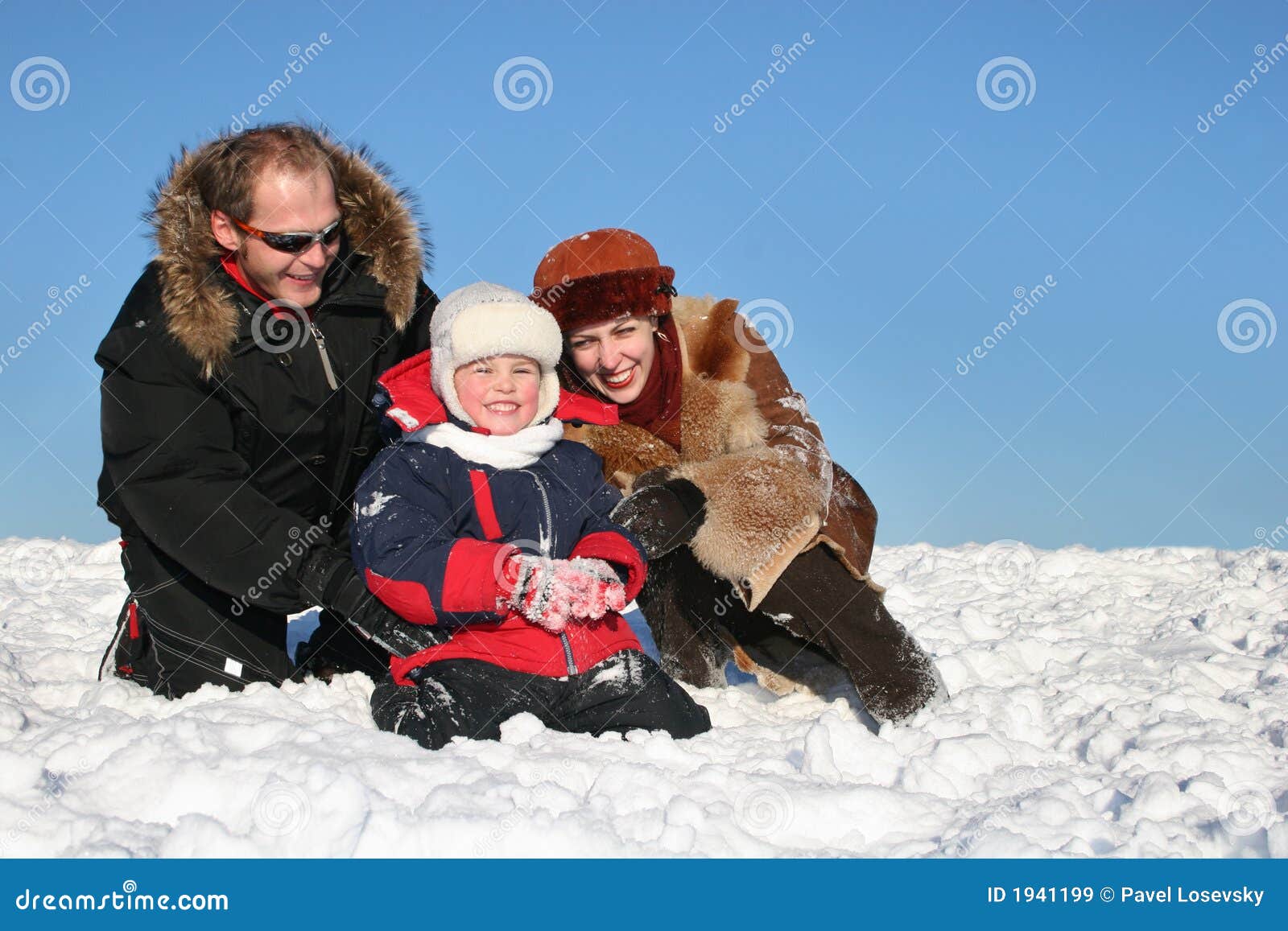 Winter family on snow stock image. Image of blue, mother - 1941199