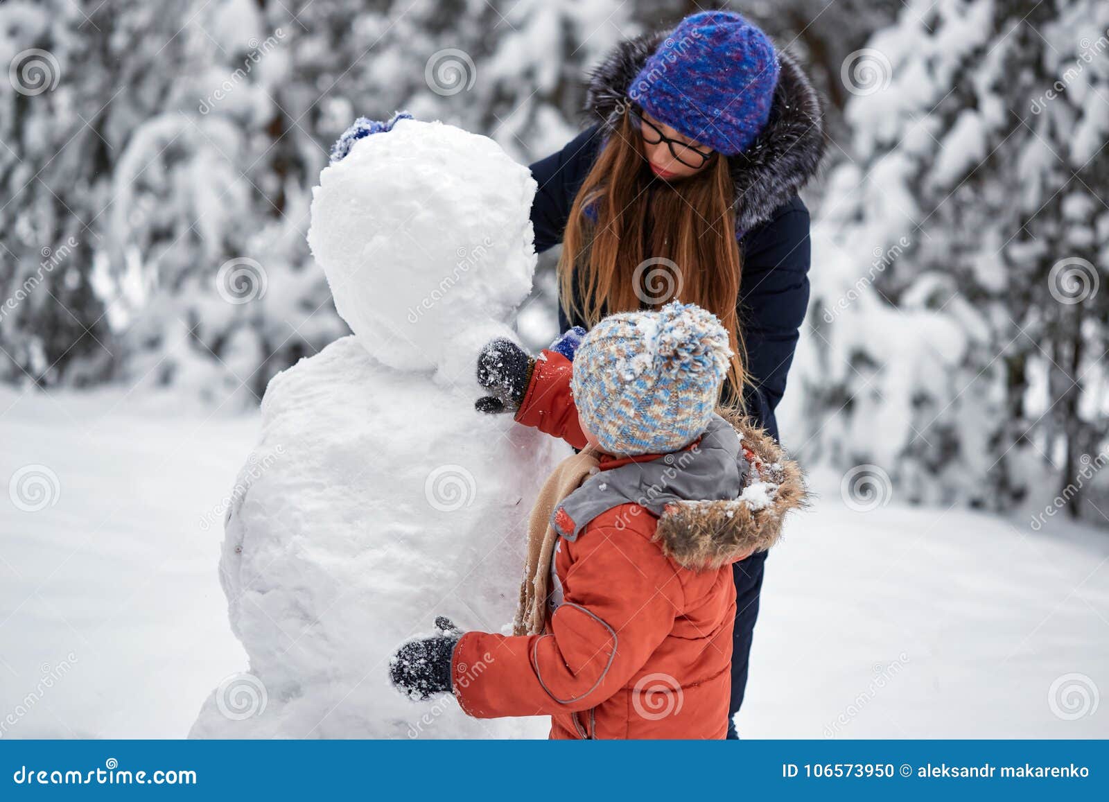 Winter Fun. a Girl and a Boy Making Snowballs. Stock Photo - Image of ...