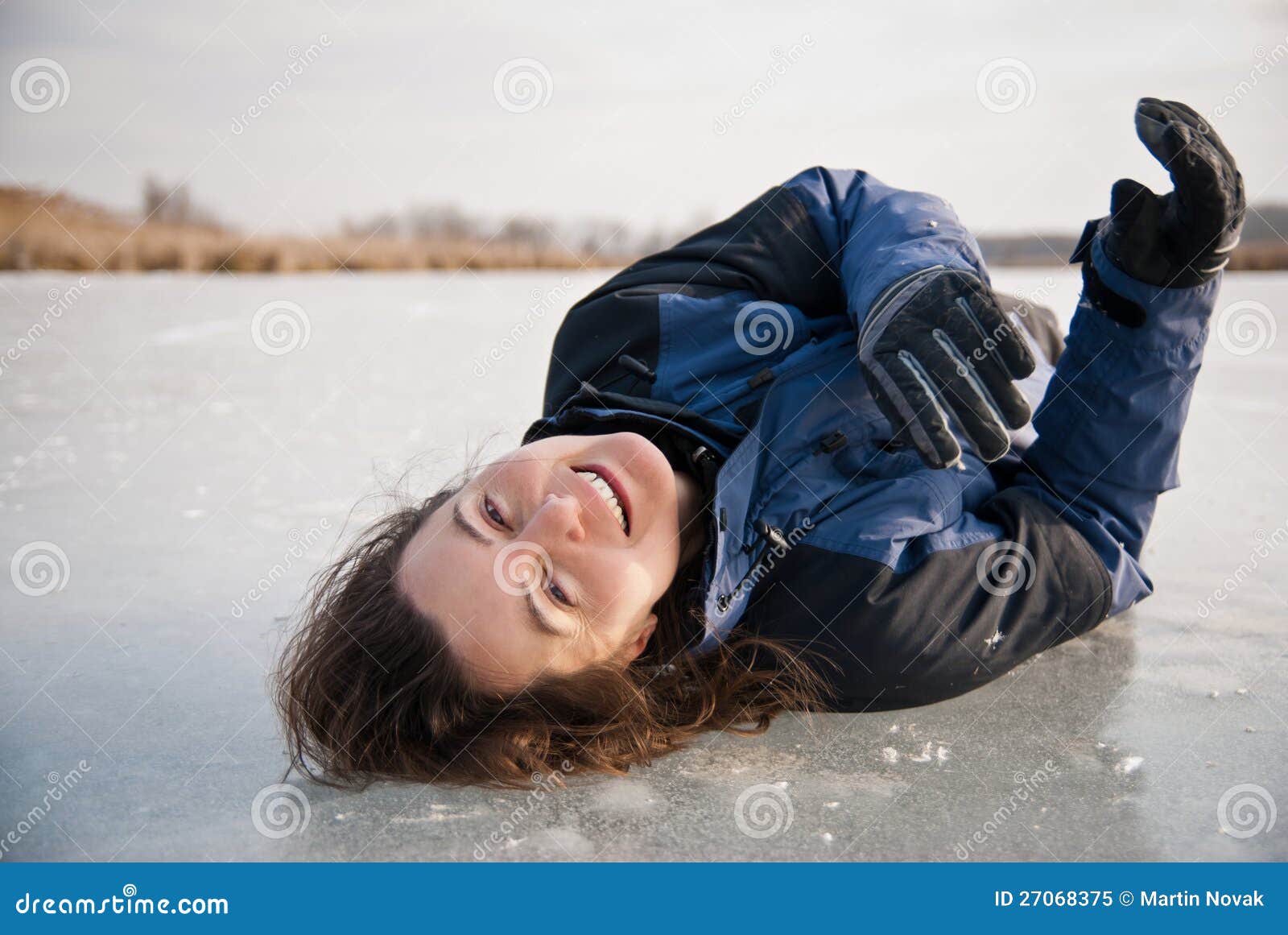 Winter fun - lying on ice stock image. Image of frozen - 27068375