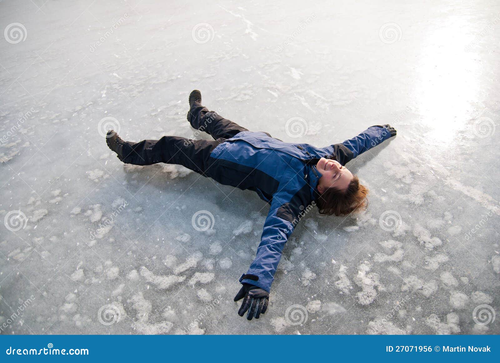 Winter fun - lying on ice stock photo. Image of people - 27071956