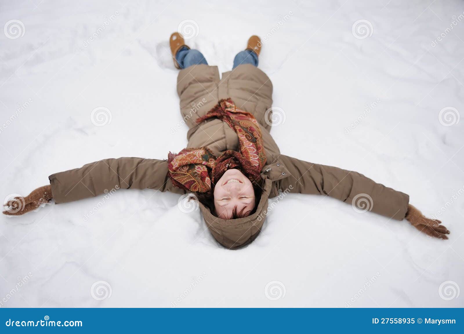 Winter fun - snow angel stock image. Image of face, expressing - 27558935