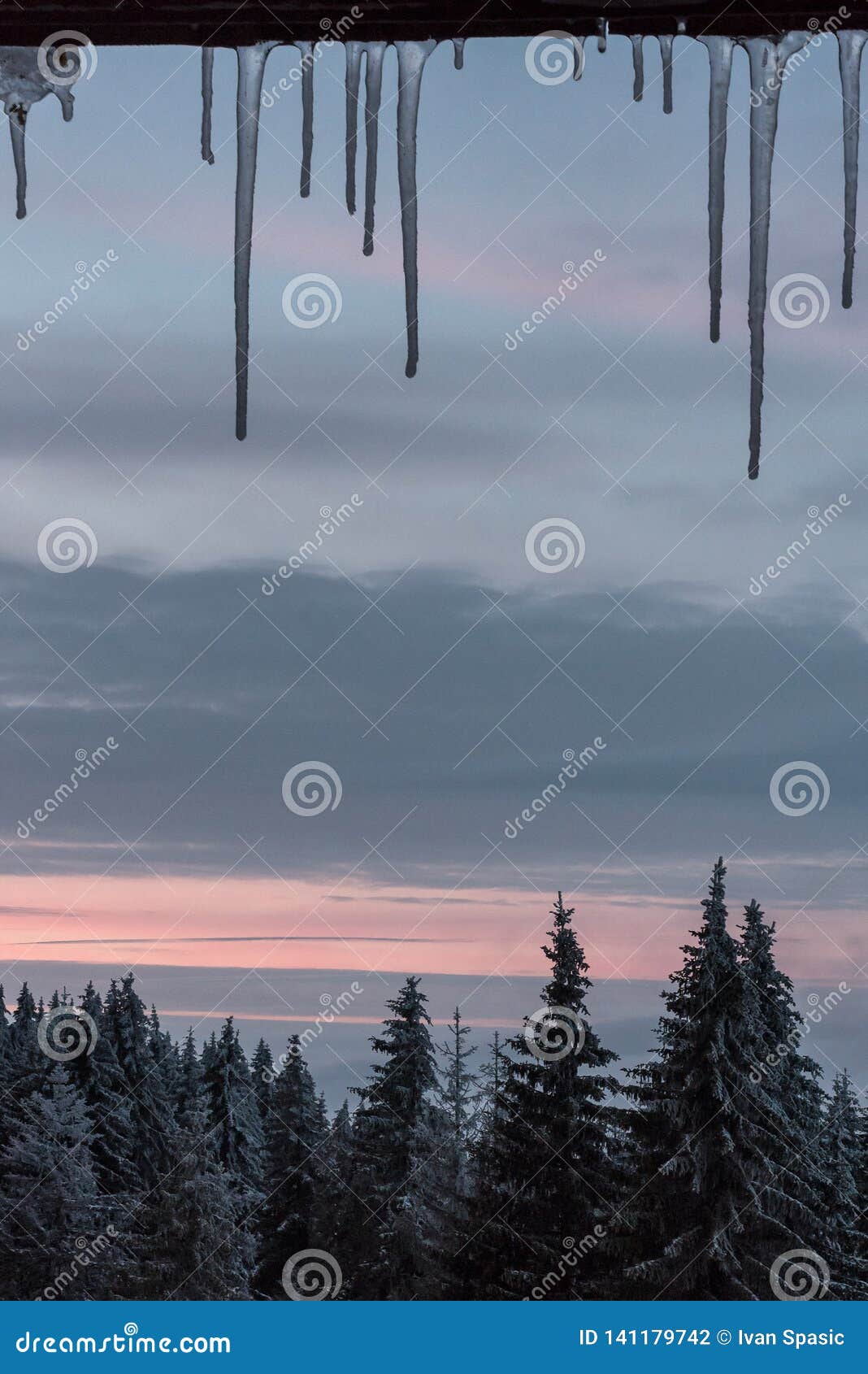 Winter Icicles on a Window Frame with a Mountain View Stock Photo ...