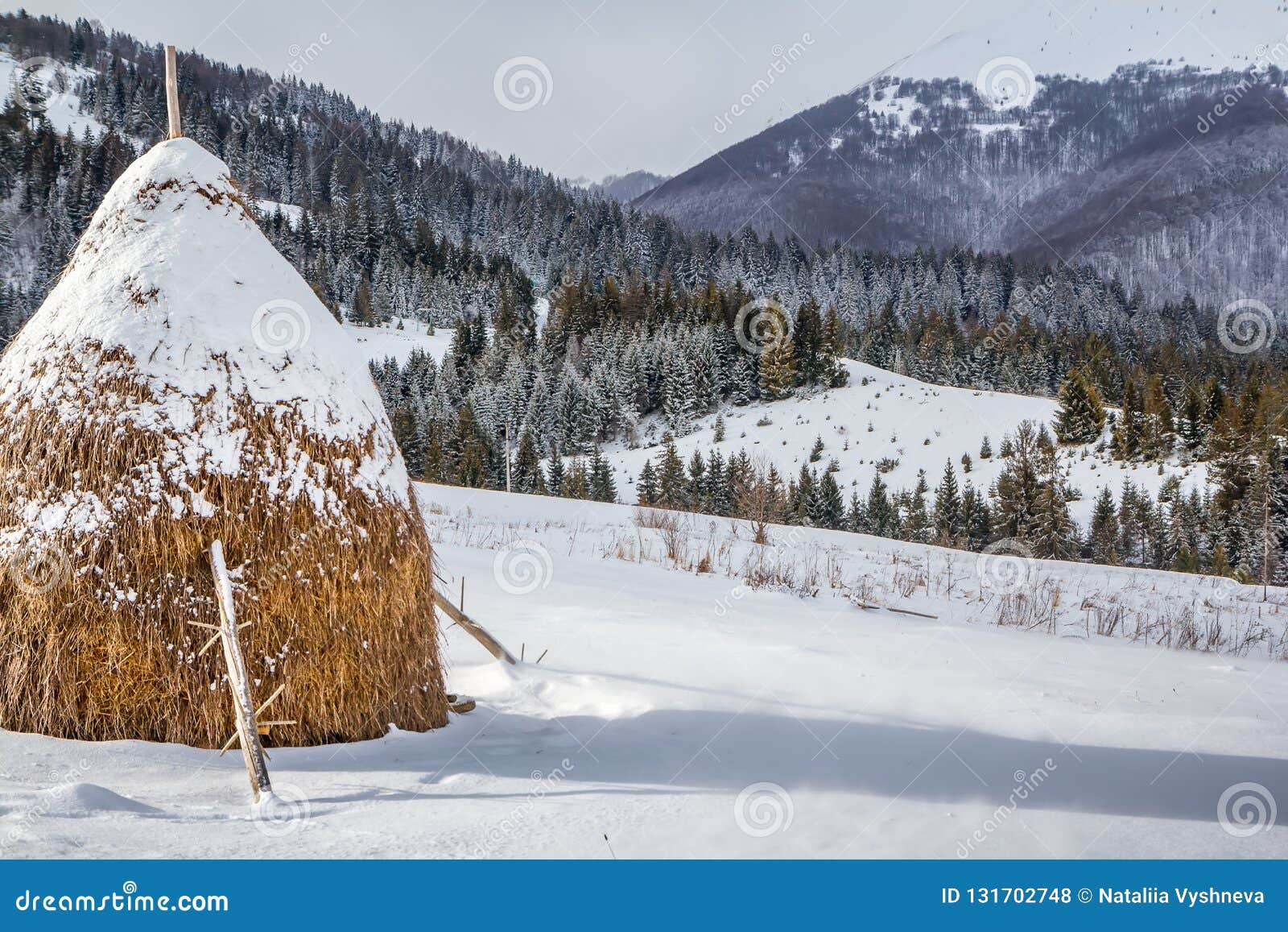 Winter Landscape, a Haystack on the Background of Snow-capped Mountains ...