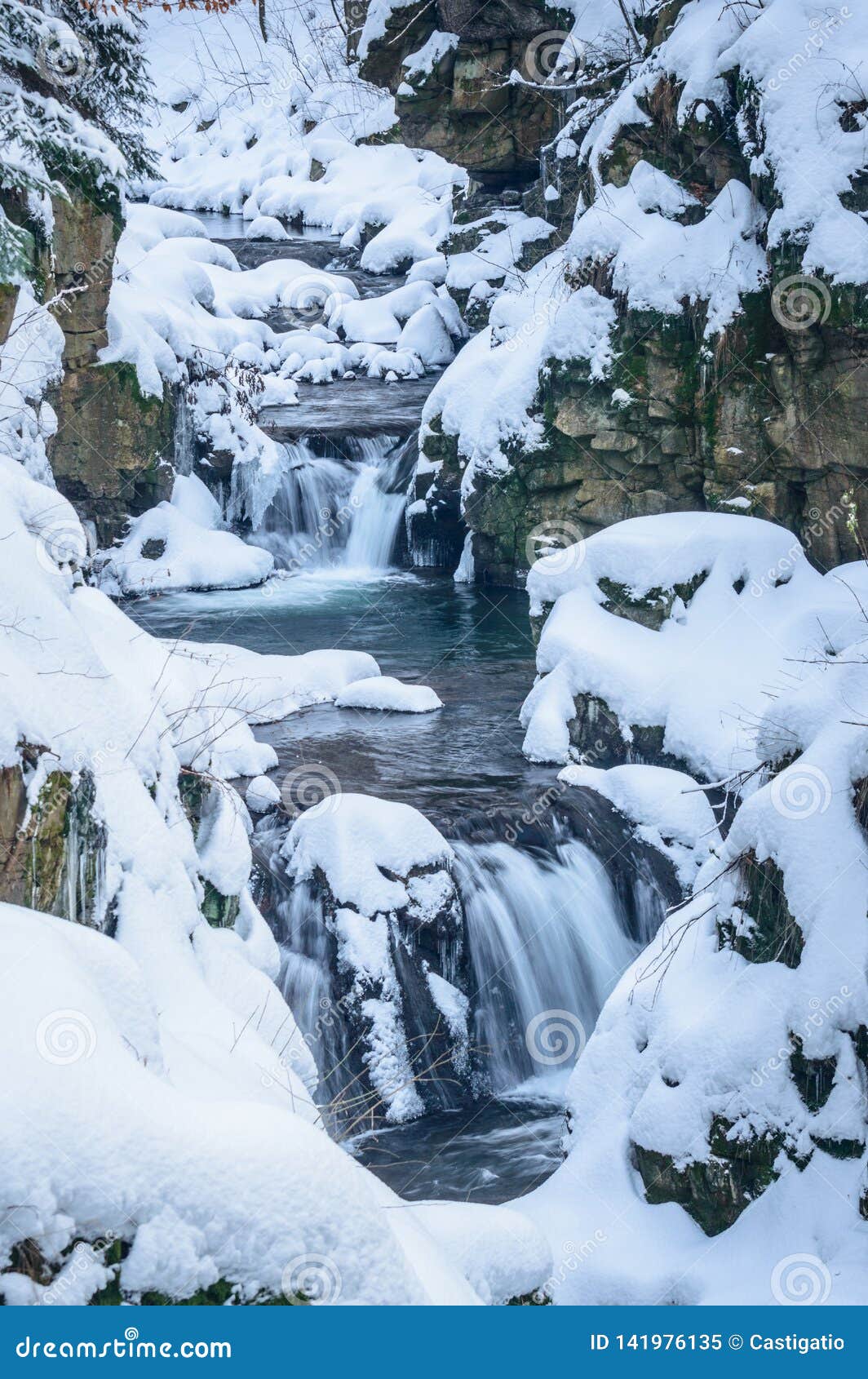 Winter Landscape with a Waterfall among the Rocks. Stock Image - Image ...