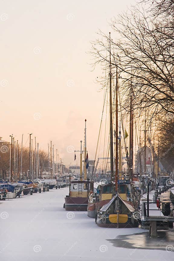 Winter Light Over Frozen Harbour Stock Photo - Image of frost, boats ...