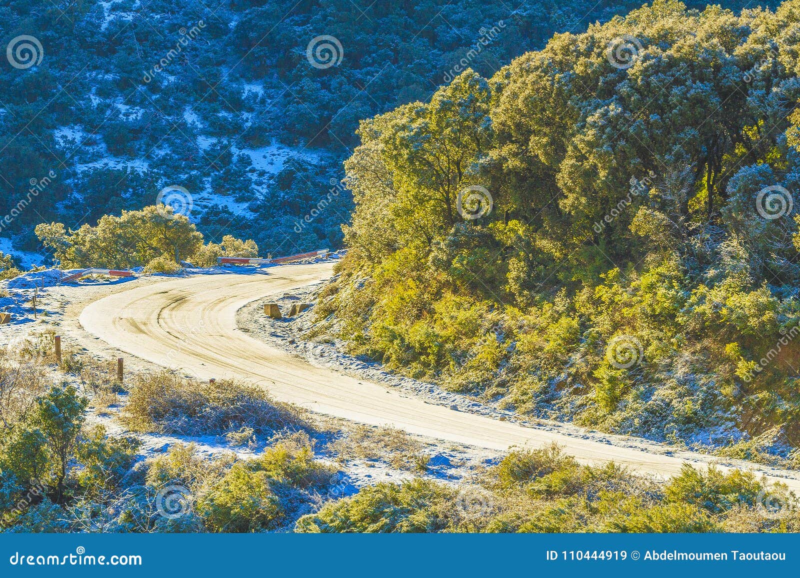 An Alpinist On A Road Surrounded By Rocky Mountains In The Fog In ...