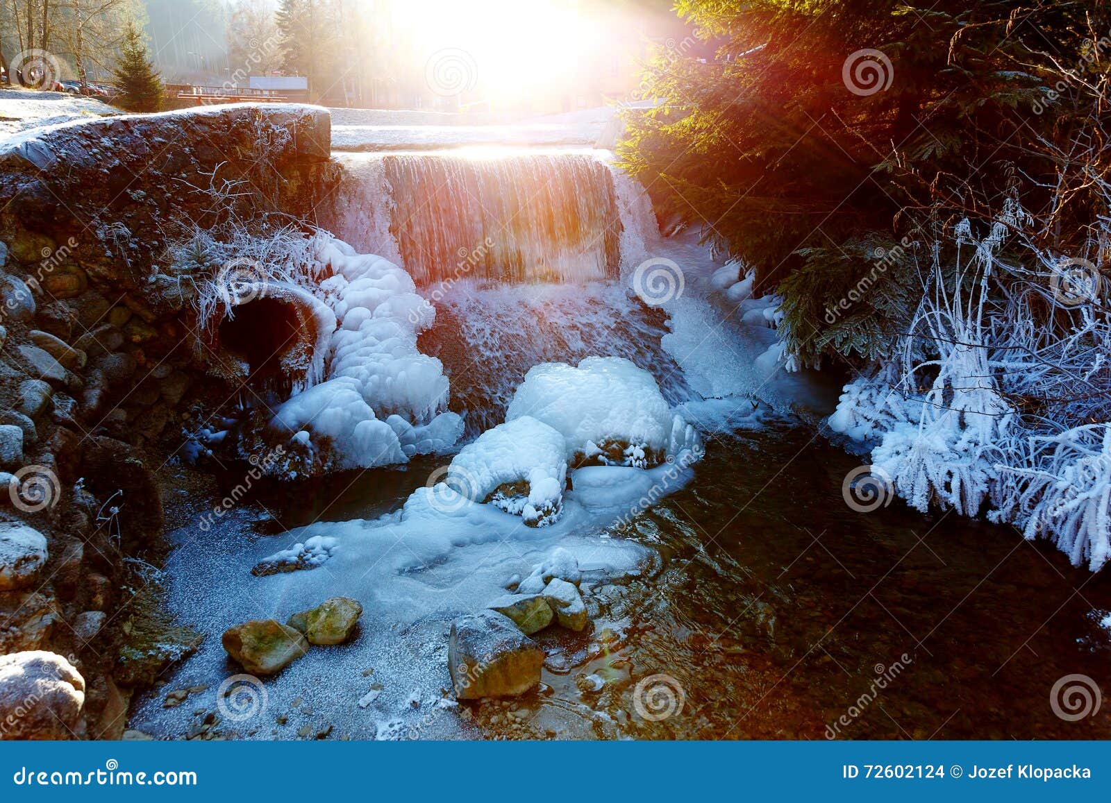 Winter Scene with Water Falling from Icy Rocks and Sun Light. Stock ...