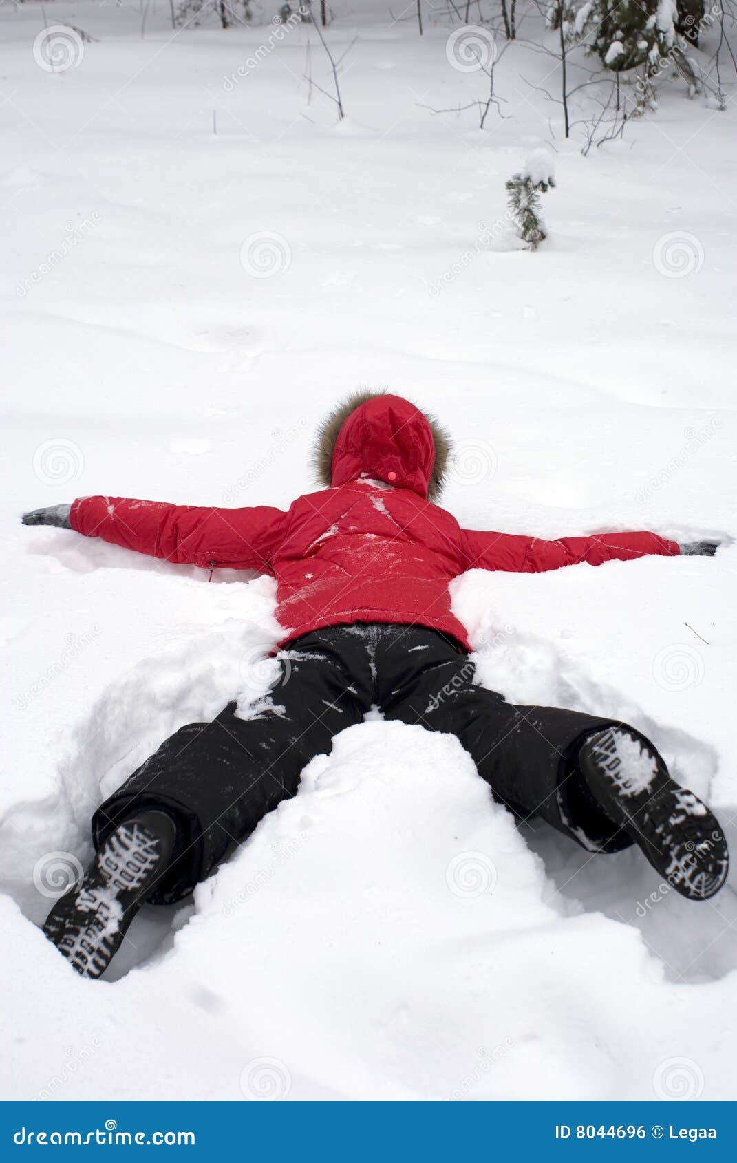 Winter snow angel stock photo. Image of jacket, weather - 8044696