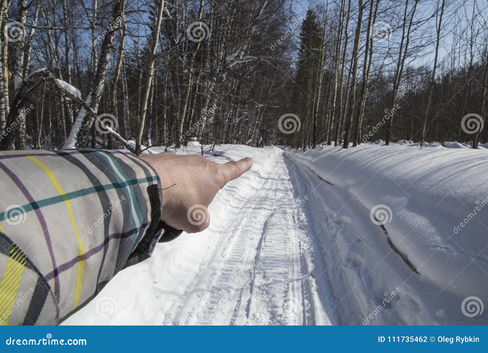 Winter. Snow. Road. the Finger of the Hand Shows the Direction of ...