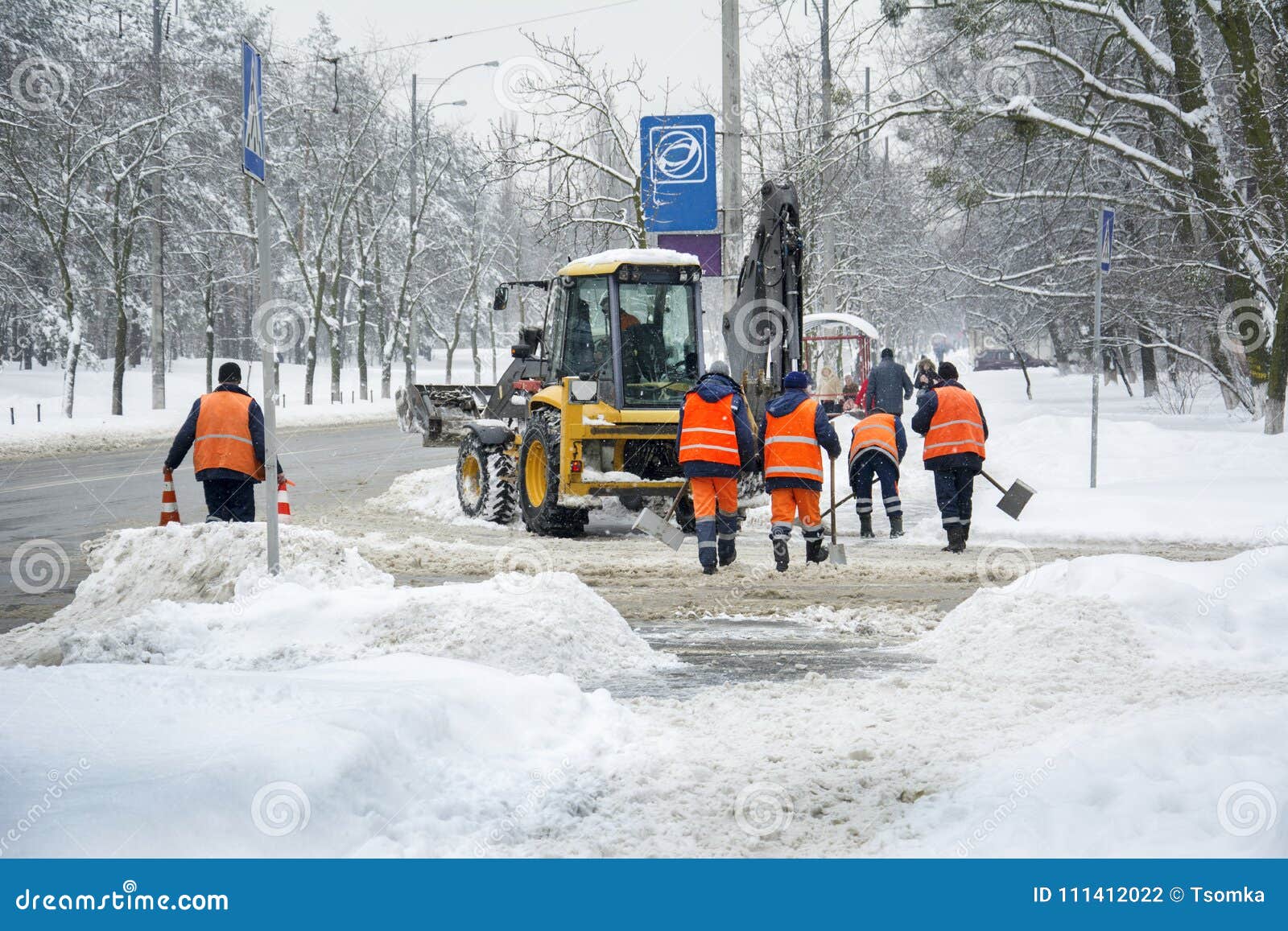 In Winter, in Snowstorm, Workers and a Tractor Clean the Road Fr Stock ...