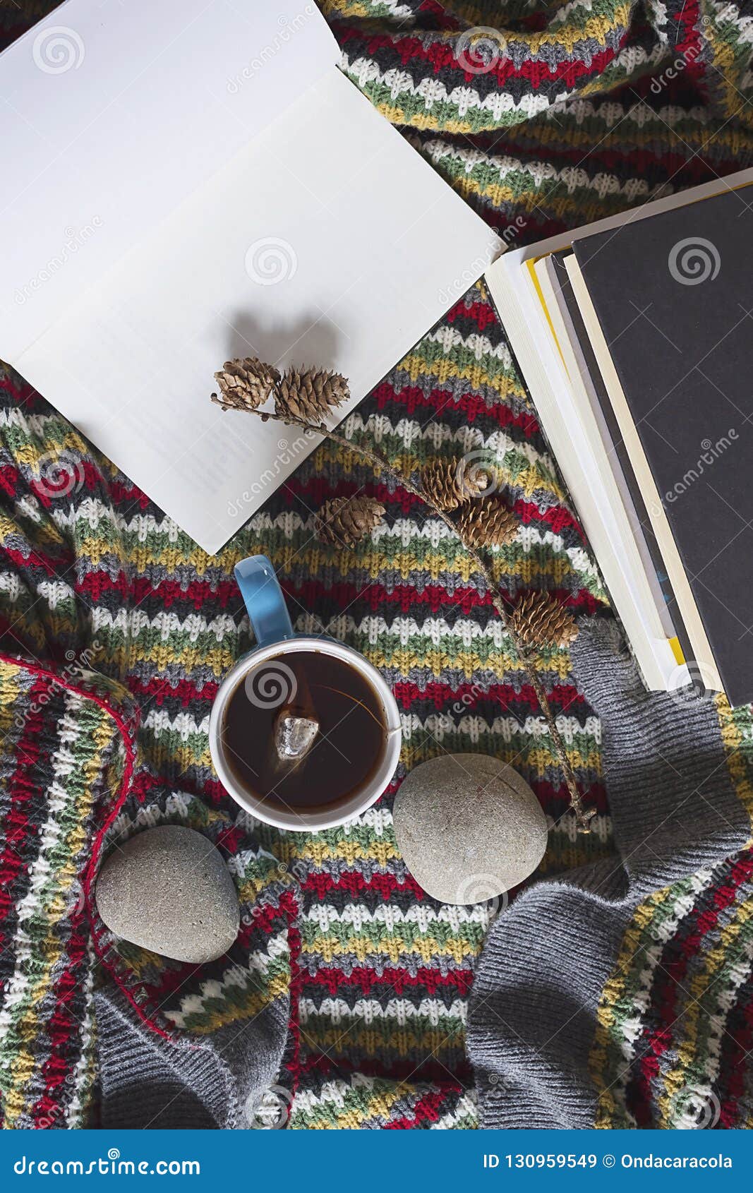 Winter tea and books scene stock image. Image of clothes - 130959549