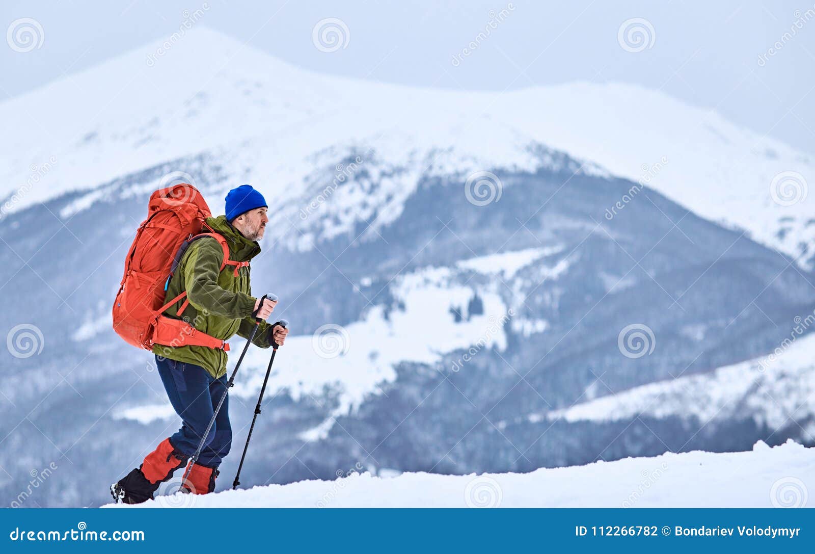 Winter Climb To the Top of the Mountain with a Backpack. Stock Photo ...