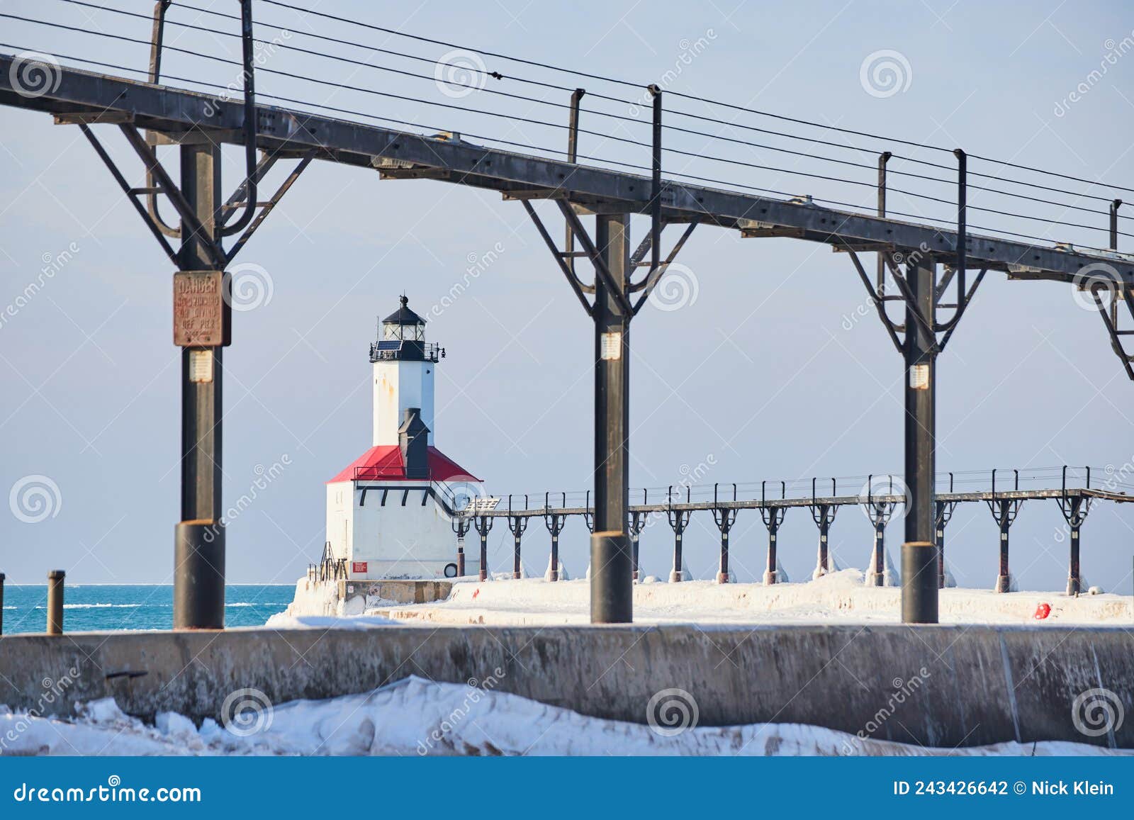 Winter View of Red and White Lighthouse through Walkway Railing Stock ...