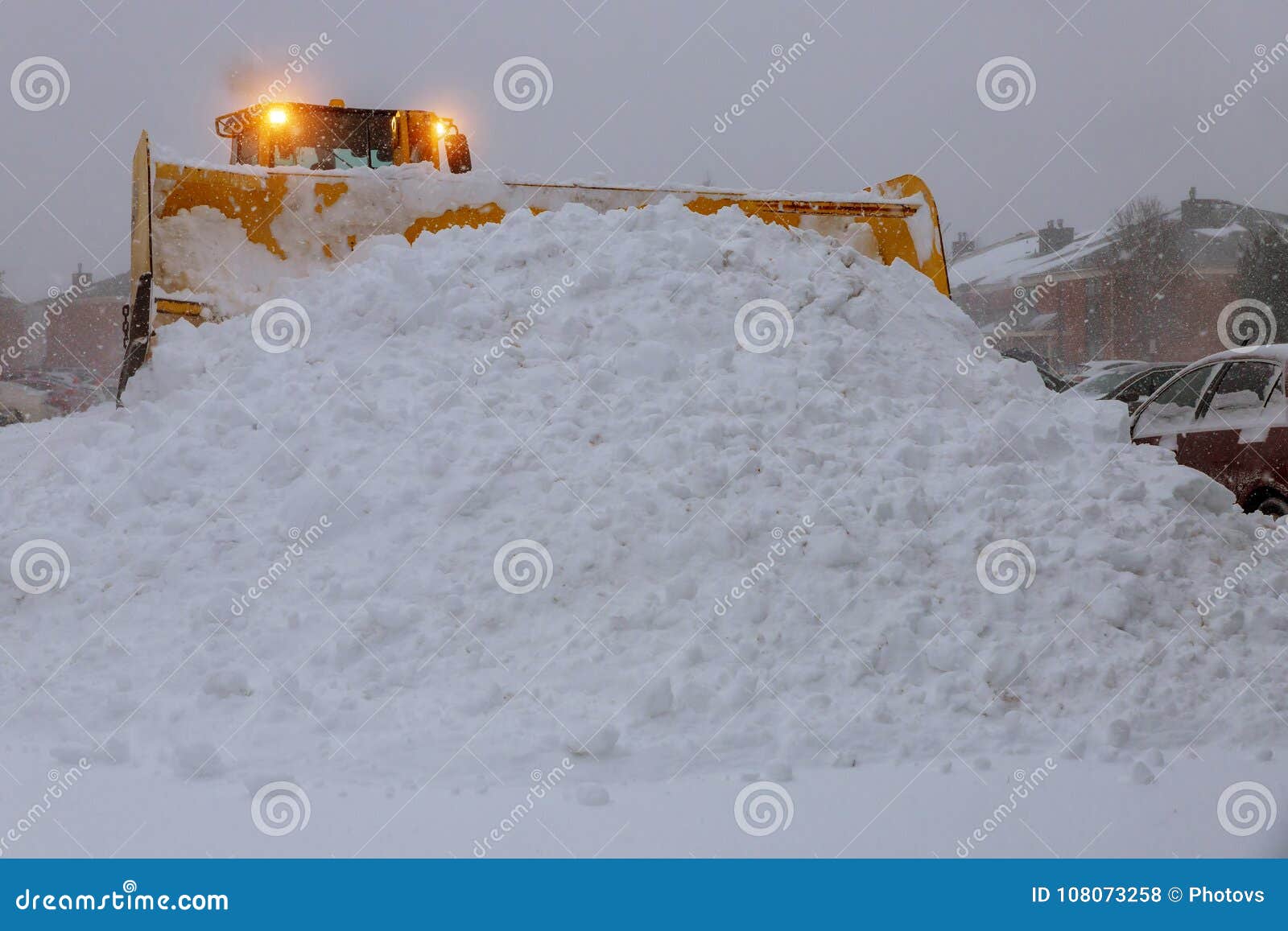 Wheel Loader Machine Tractor Removing Snow. Clearing the Road from Ice ...