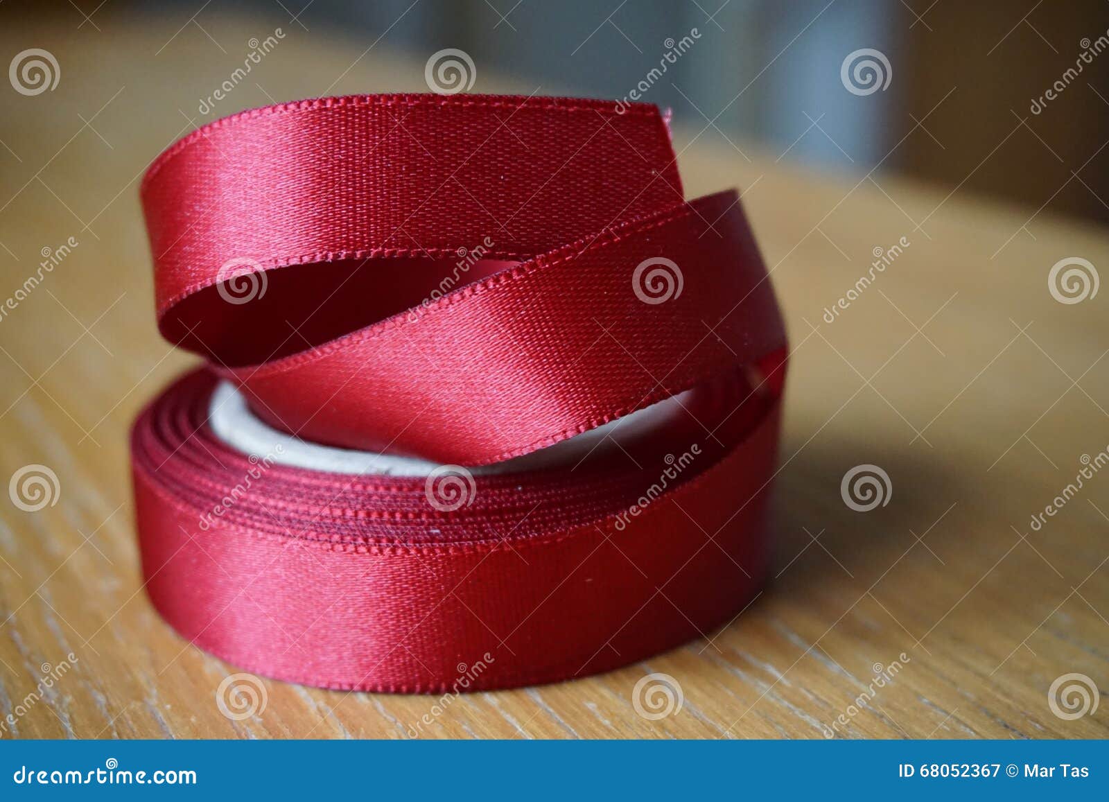 Winy Red Ribbon Loop on the Wooden Desk Stock Image - Image of reel ...
