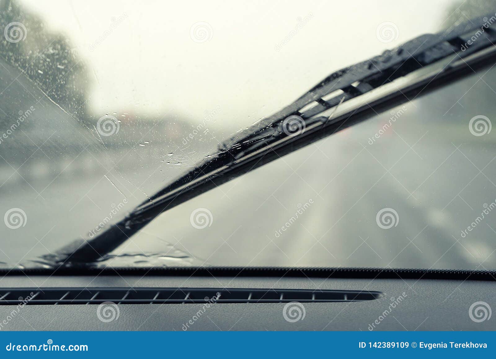 Wipers Clean the Windshield of the Car from Rain Drops. View from ...